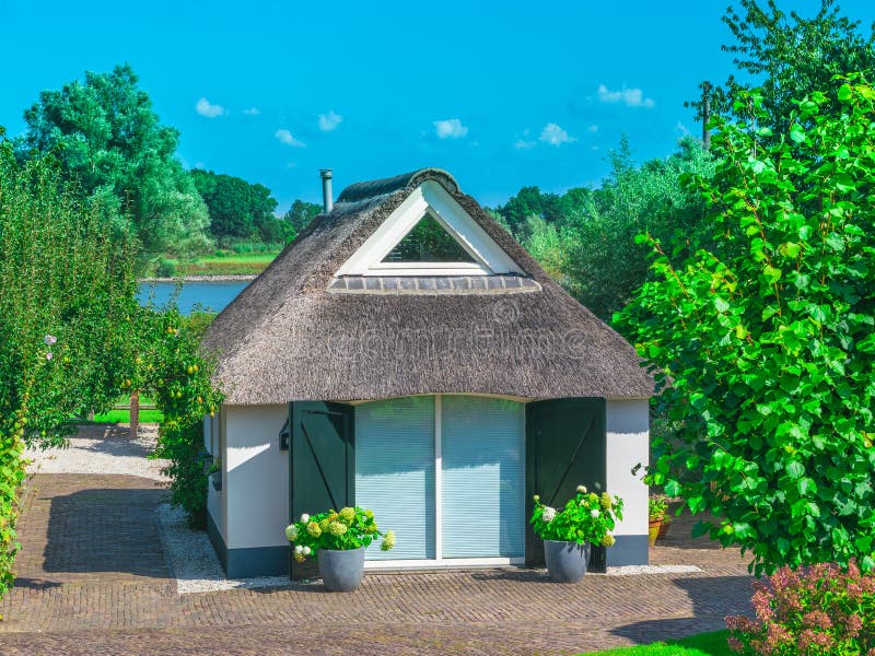 A Row of Old Dutch Traditional Houses during Sunrise on the Wadden ...