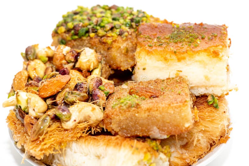 Traditional Oriental Sweets in White Plate with Different Nuts on a ...