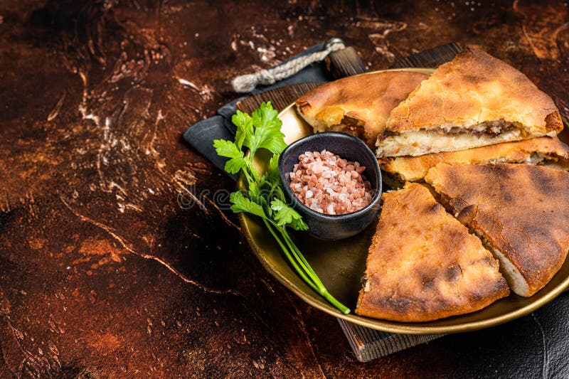 Traditional Ossetian Pie Sliced on a Plate. Dark Background. Top View ...