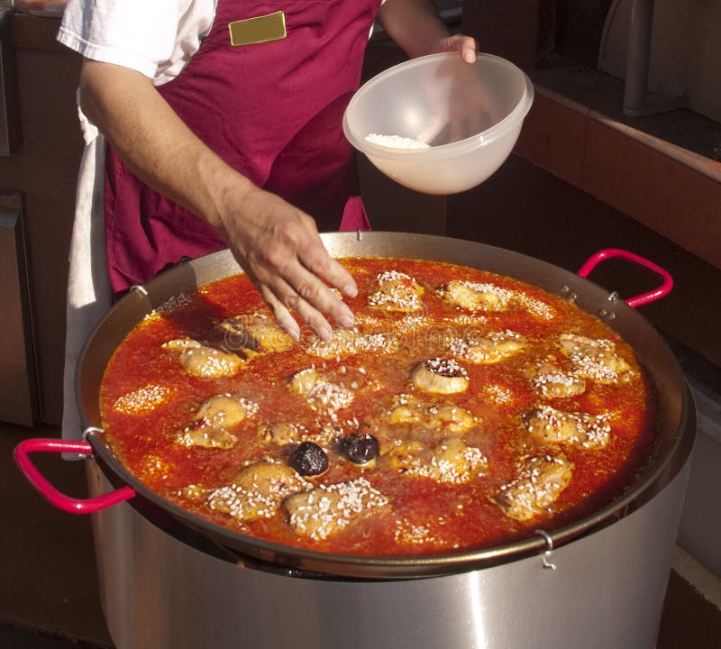 Traditional Paella Being Cooked in Large Pot Stock Photo - Image of ...