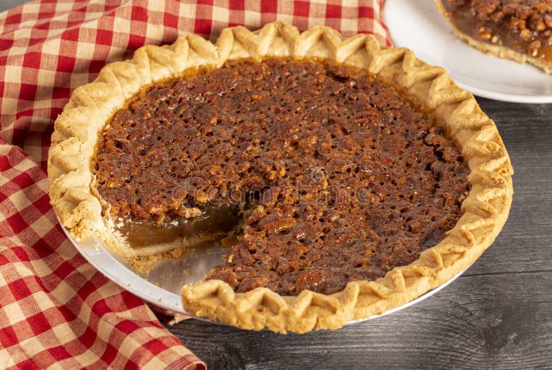 A Traditional Pecan Pie with a Slice Cut Out Stock Photo - Image of ...