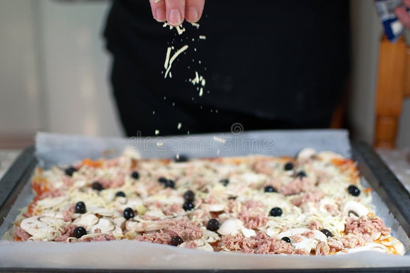Traditional Pizza Cooking by Italian Chef at Home. Adding Some Cheese ...