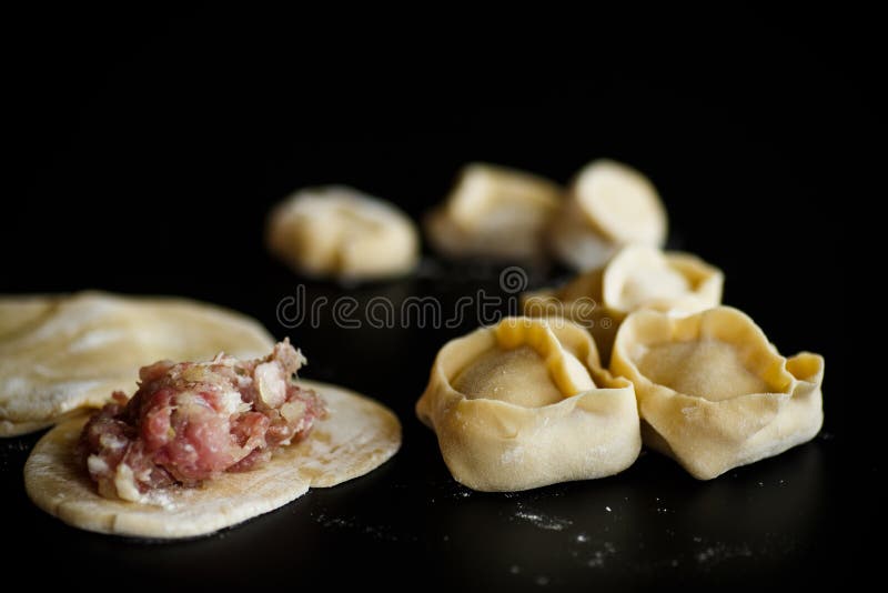 Preparation of Pelmeni. Top View. Ingredients on Black Table ...