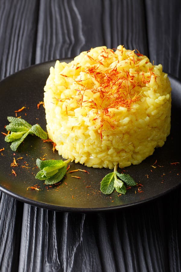 Traditional Risotto Alla Milanese with Saffron is Decorated with Stock ...
