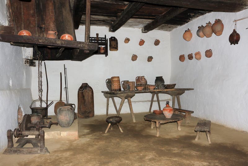 Traditional Romanian Interior of a Kitchen with Many Tools and a Stock ...