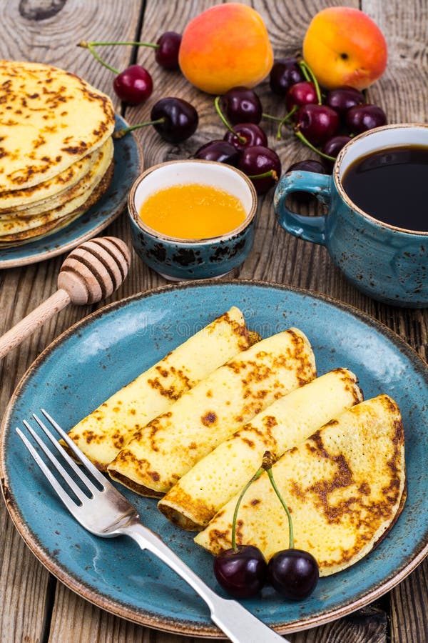 Traditional Russian Breakfast Pancakes with Fruit and Honey Stock Photo ...