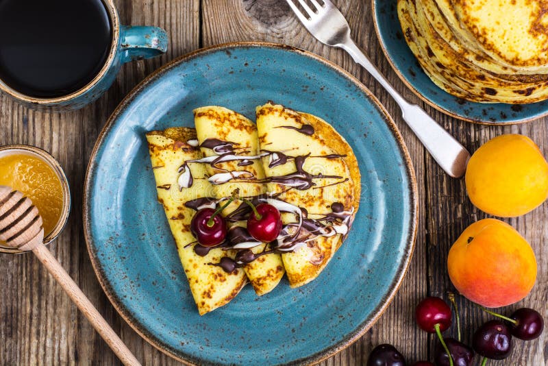 Traditional Russian Breakfast Pancakes with Fruit and Honey Stock Photo ...