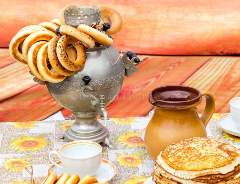Traditional Russian Samovar with Tasty Bagels and Ceramic Tableware ...