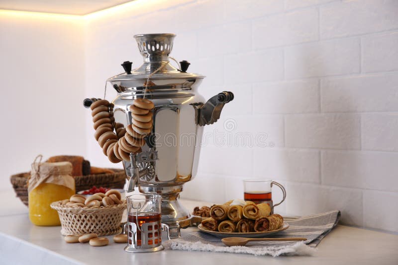 Traditional Russian Samovar with Treats on White Table Stock Image ...