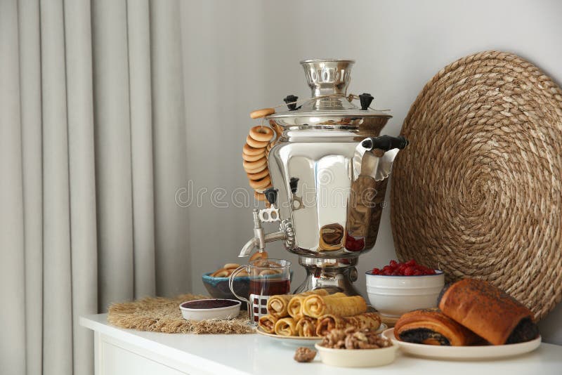 Traditional Russian Samovar with Treats on White Table at Home. Space ...