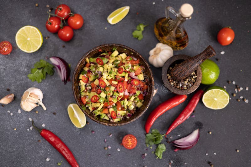 Traditional Salsa Dip Snack in Wooden Bowl on a Table with Ingredients ...