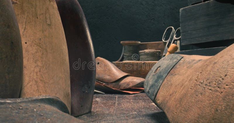 Traditional Shoemaker Workshop with with Tools, Anvil, Shoes and Rule ...