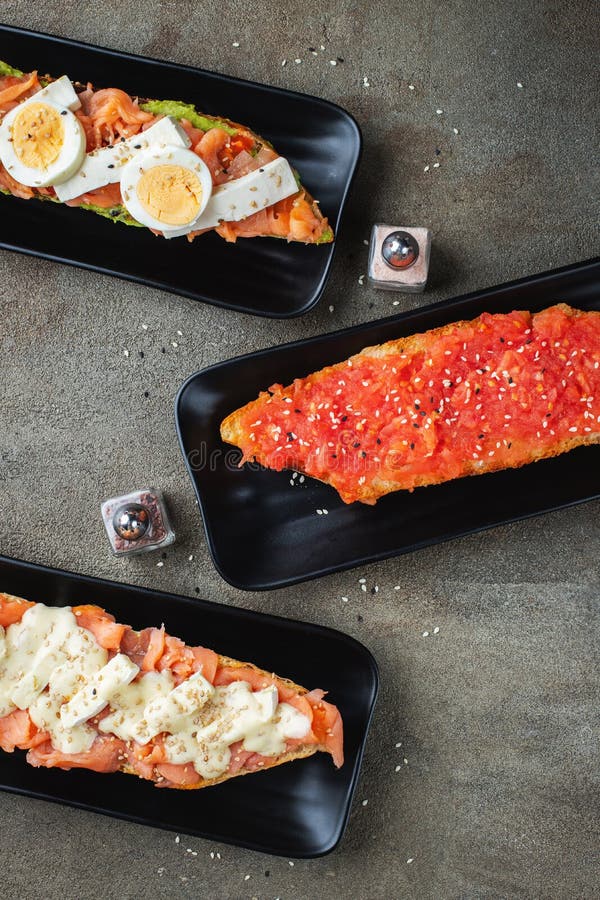 Traditional Spanish Breakfast. Tostada with Different Toppings on a ...