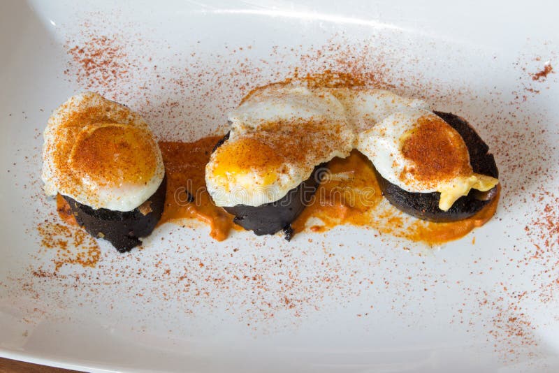 Traditional Spanish Tapas of Quail Egg Sausage and Cayenne Stock Image ...
