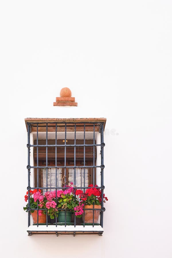 Traditional Spanish Window with Flower Pots on White Wall Stock Image ...