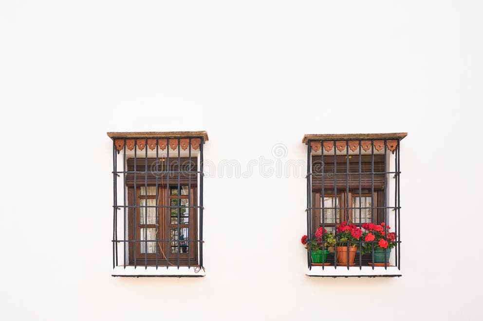 Traditional Spanish Window with Flower Pots on White Wall Stock Image ...