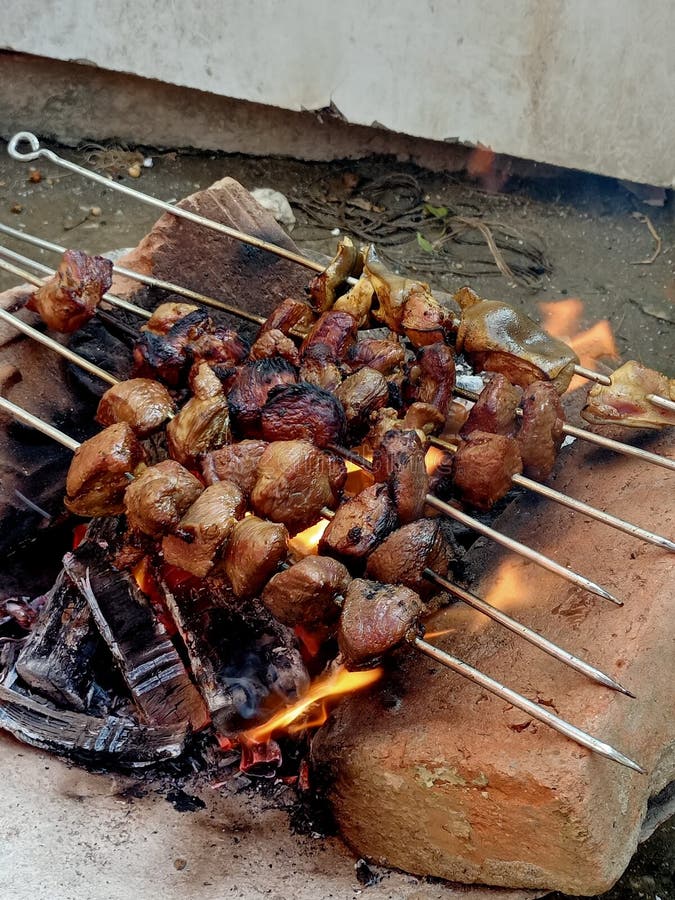 Traditional Style of Smoky Village Barbecue in an Open Kitchen Stock ...