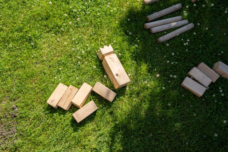 Traditional Swedish Park Game Kubb on a Lawn.. Stock Photo - Image of ...
