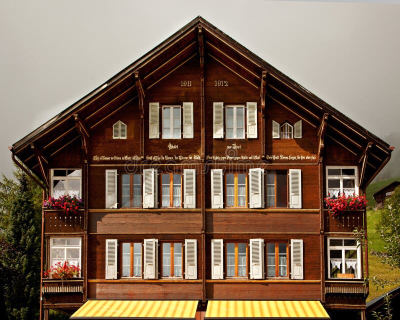 Traditional Swiss Chalet stock image. Image of inscription - 18224565