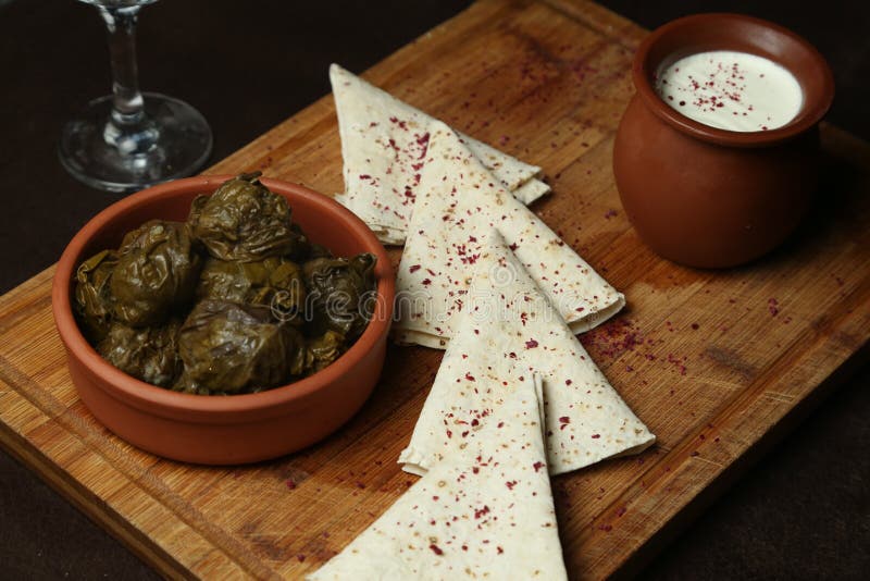 Traditional Turkish Dolma with Yogurt Stock Image - Image of leaves ...
