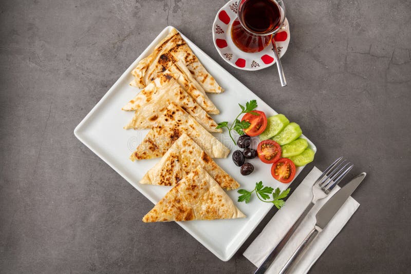 Traditional Turkish Flatbread or Gozleme with Tomatoes, Olives and Tea ...