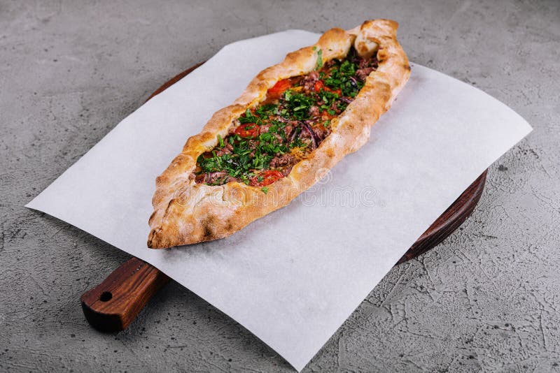 Traditional Turkish Meat Pide on Wooden Stock Photo - Image of ...