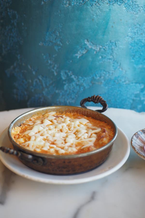 Traditional Turkish Menemen Served in Rustic Pottery on a Marble Table ...
