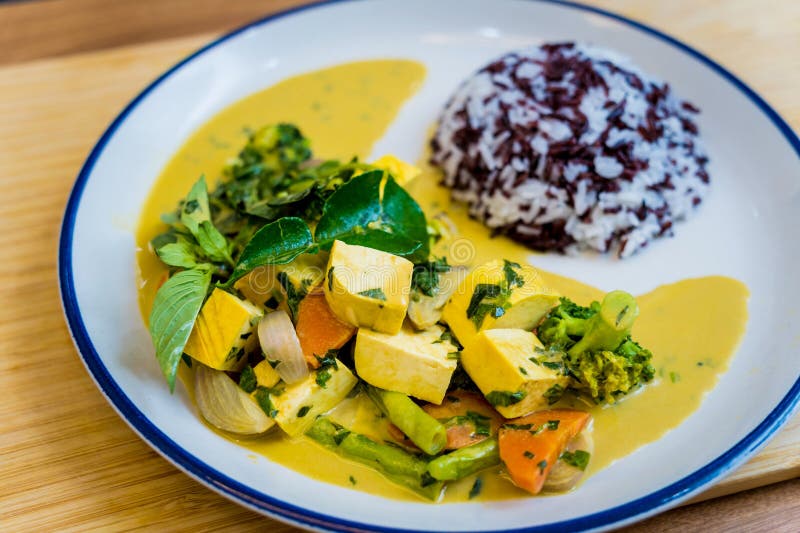 Traditional Vegetable Green Curry with Herbs and Steamed Rice Stock ...