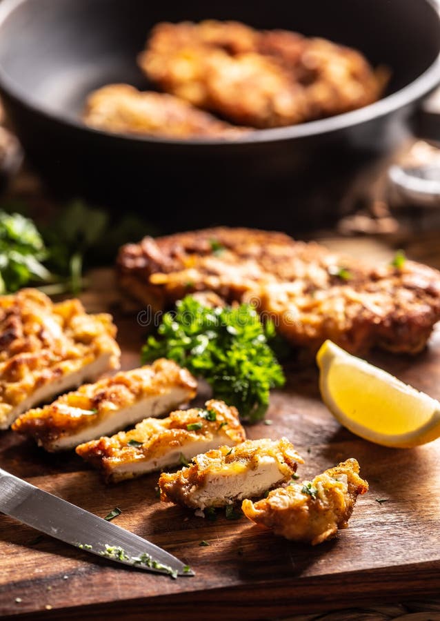 Traditional Viennese Chicken Schnitzel on a Wooden Board Stock Image ...