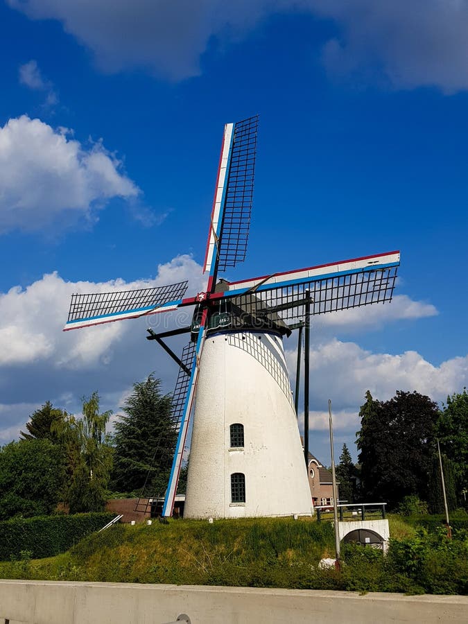 Traditional Windmill Situated in a Scenic Outdoor Setting, with Lush ...