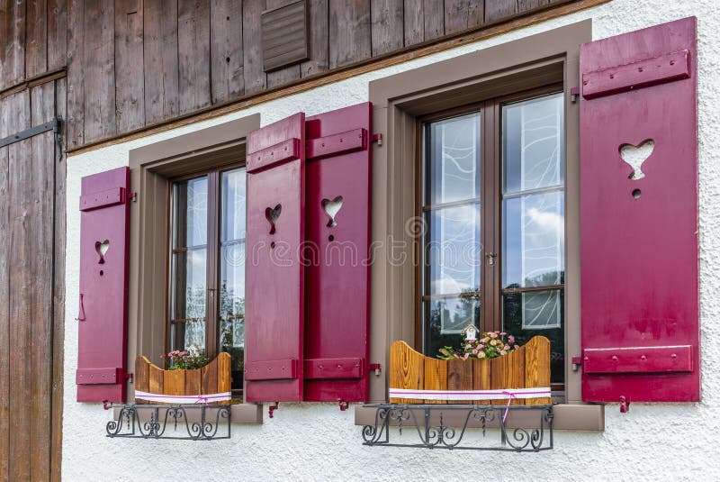 Traditional Wood Red Windows in Switzerland with Flower Pots Stock ...