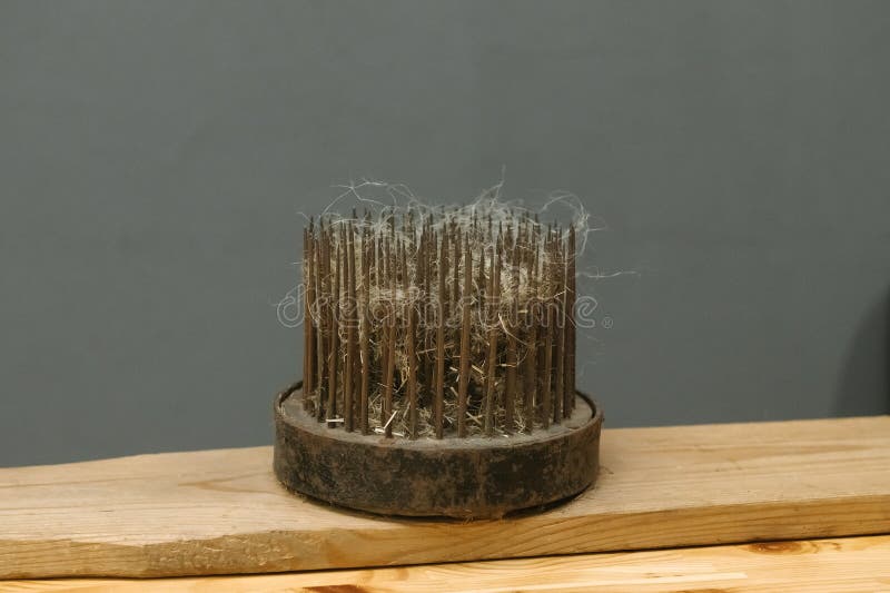 Traditional Wool Carding Comb on Wooden Surface for Textile Crafting ...