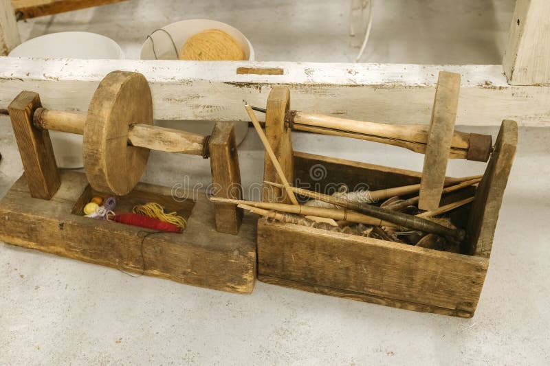 Traditional Wool Spinning Tools and Yarn Display in Rustic Workshop ...