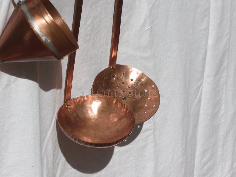Traditionally Handcrafted Copper Kitchen Utensils Against White ...