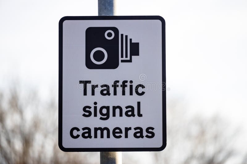 Traffic Camera Sign and Reads "TRAFFIC SIGNAL CAMERAS" Along with Along ...