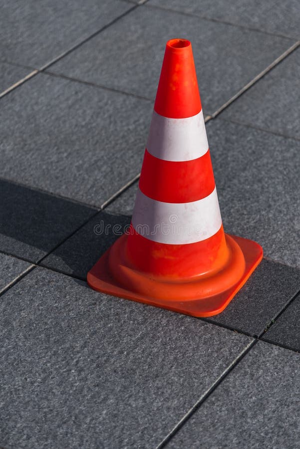 Traffic Cone Standing on Sidewalks Tiles Stock Image - Image of ...