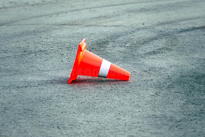 Traffic Cone Tipped Over on Pavement Stock Photo - Image of stop, deep ...