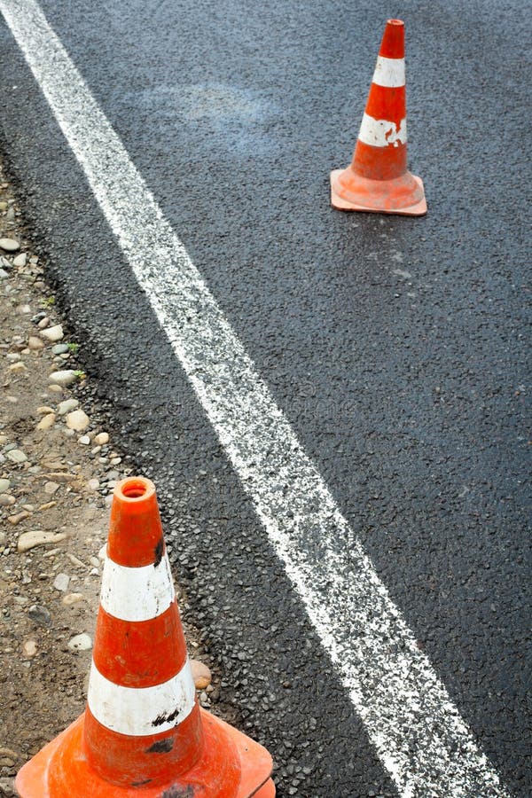 Traffic cones on the road stock image. Image of pylon - 261631797
