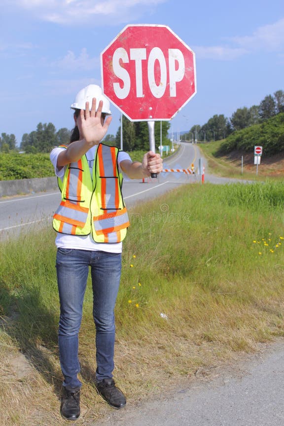 Traffic Controller Stopping Traffic Stock Image - Image of slow ...