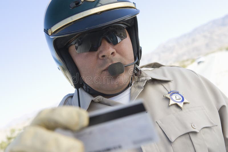 Traffic Cop Holding License Stock Photo - Image of mike, mature: 29651188