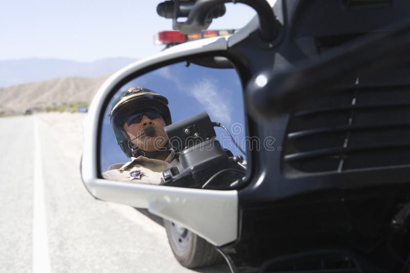 Traffic Cop Reflecting in Side View Mirror Stock Photo - Image of ...