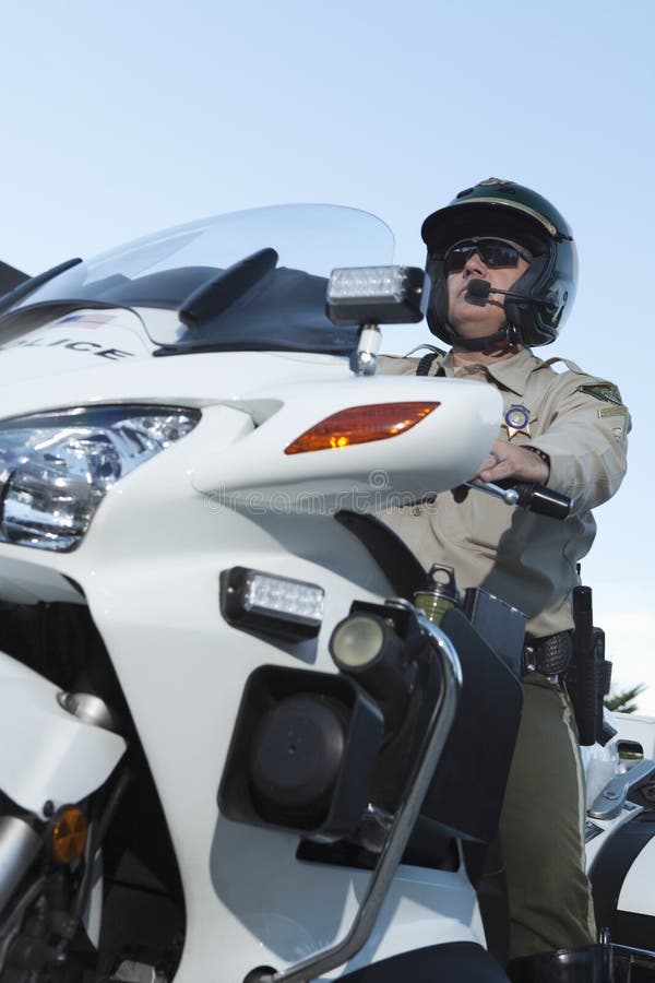 Traffic Cop Sitting on Bike Against Sky Stock Image - Image of adult ...