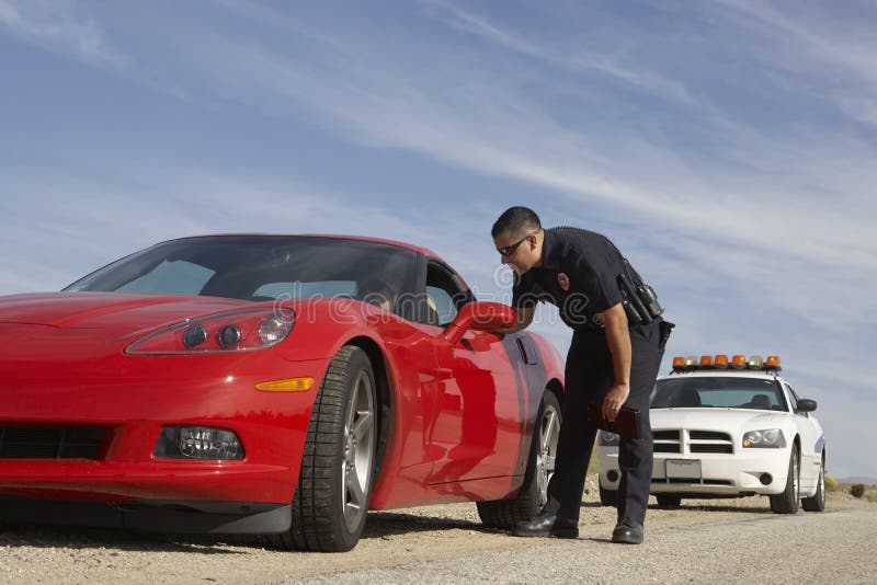Traffic Cop Stopping Red Sports Car Stock Photo - Image of driver ...