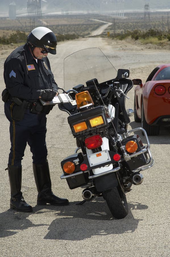Traffic Cop by Motorcycle stock image. Image of middle - 32031523
