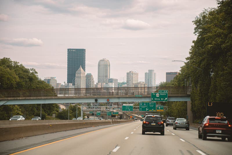 Traffic Flows on Highway Toward Pittsburgh Skyline Under Cloudy Sky ...