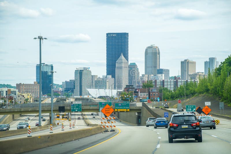 Traffic Flows on Highway Toward Pittsburgh Skyline Under Cloudy Sky ...