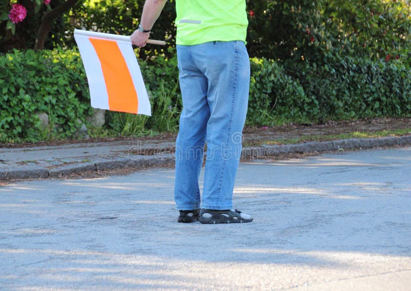Traffic Guide with Flag at Running Race Stock Photo - Image of sign ...