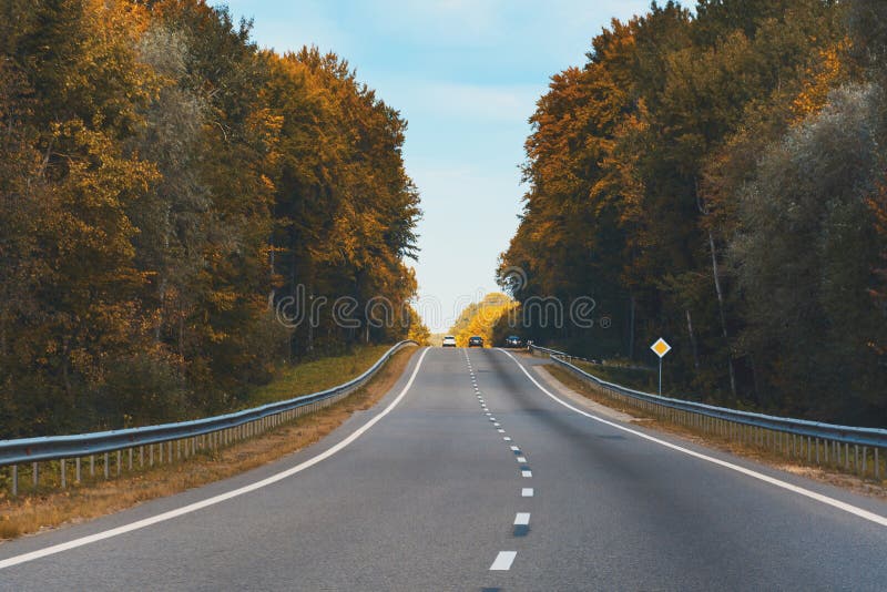Traffic in High Speed on a Highway through Rural Landscape on Sunset ...