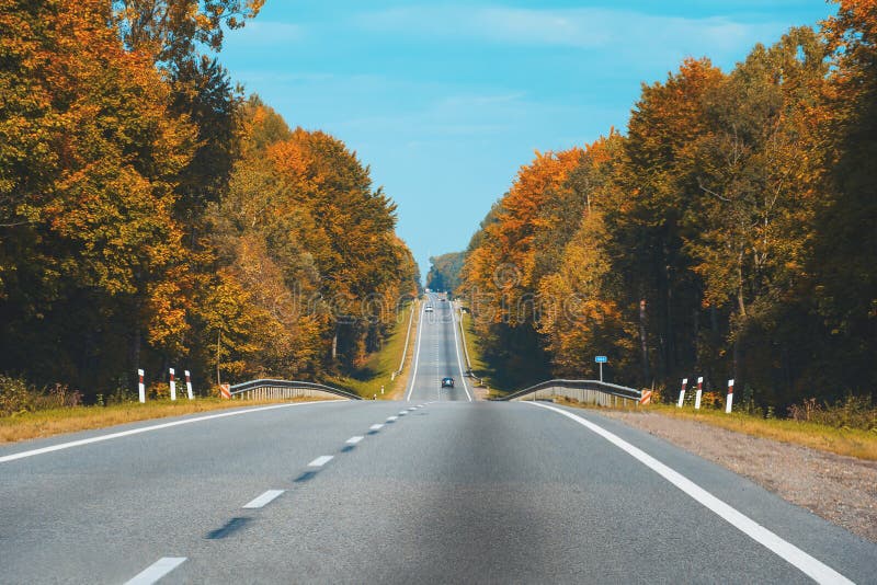 Traffic in High Speed on a Highway through Rural Landscape on Sunset ...
