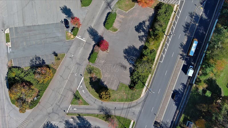 Traffic Intersection Surrounded by Greenery and Parking Lot Viewed from ...
